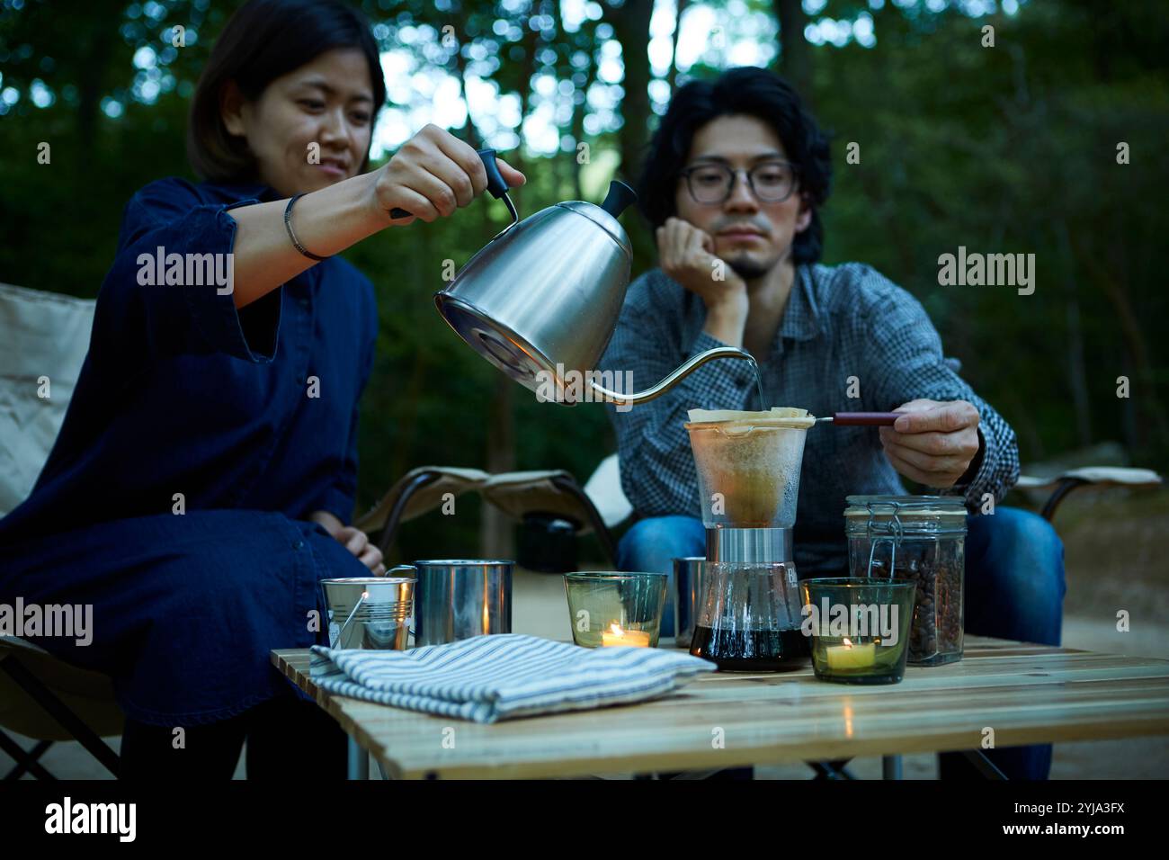 Two people dripping coffee outside Stock Photo - Alamy