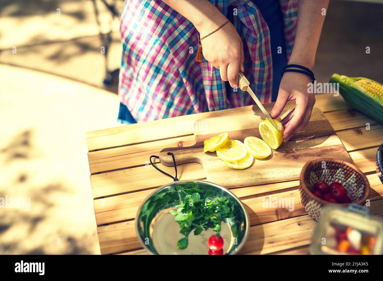 Woman cooking in camp Stock Photo - Alamy