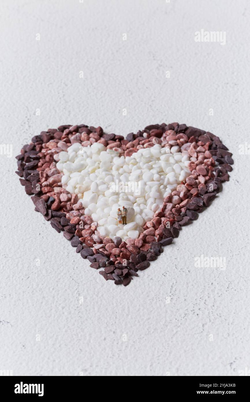 Heart of pebble and elderly couple Stock Photo - Alamy