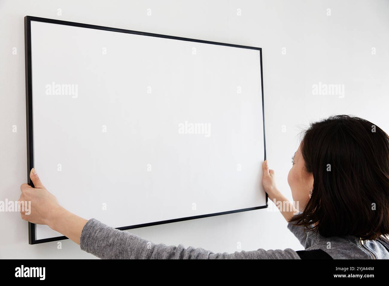 Person hanging art hi-res stock photography and images - Alamy