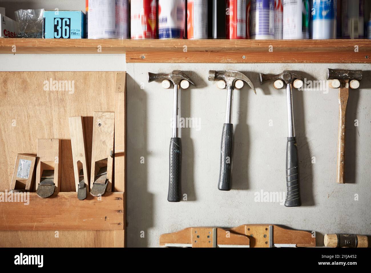 Tools lined up on the wall Stock Photo - Alamy
