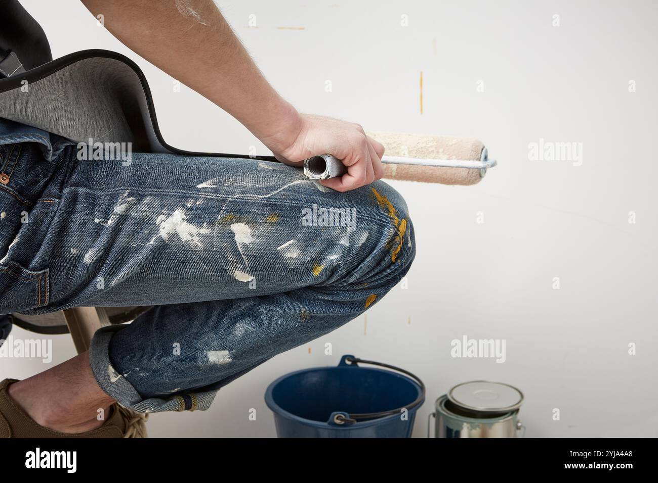 Man using roller Stock Photo - Alamy