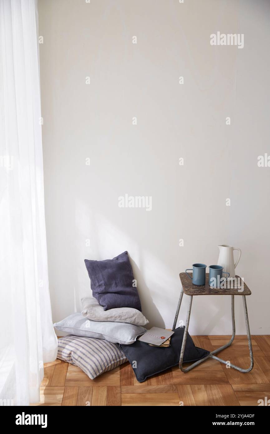 Relaxing space by a bright window Stock Photo - Alamy
