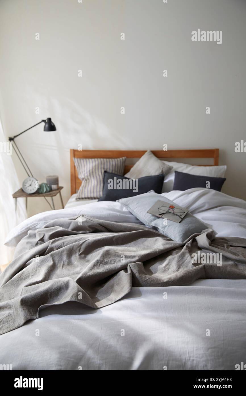 Simple bedroom with bright light Stock Photo - Alamy