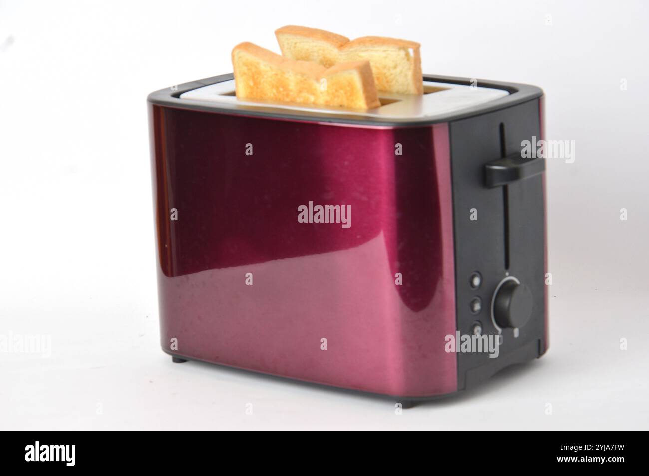 toast on toaster machine with white background Stock Photo - Alamy