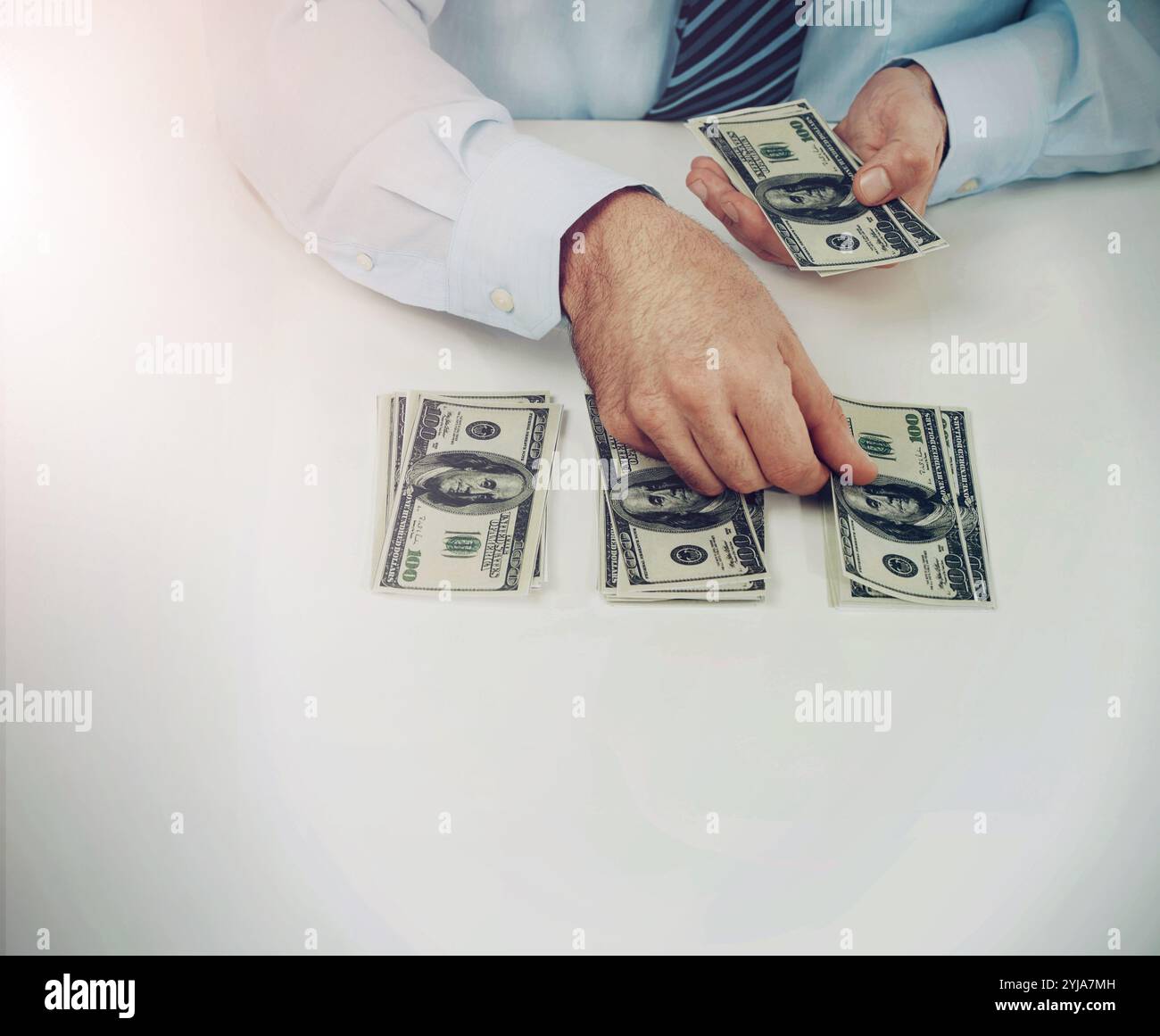 Hands counting dollar bills table hi-res stock photography and images ...