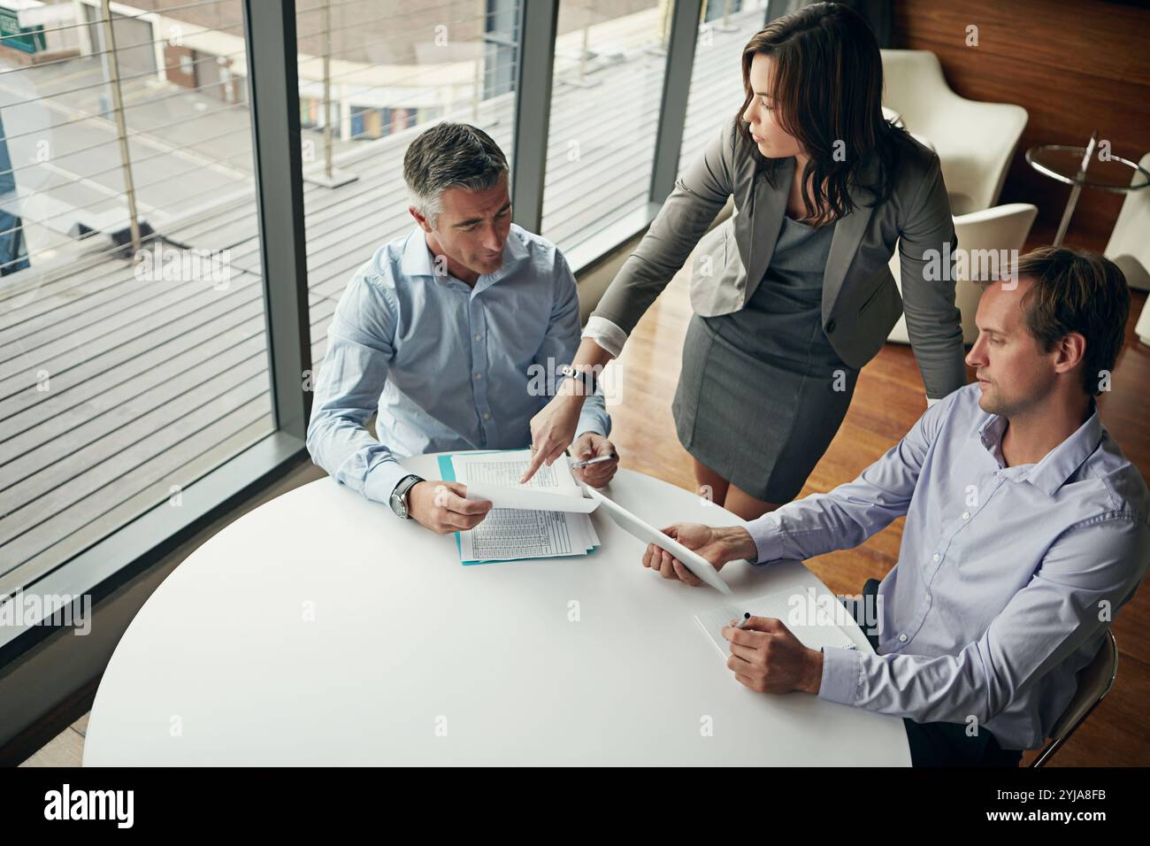 Business, people and discussion with legal document at office for ...