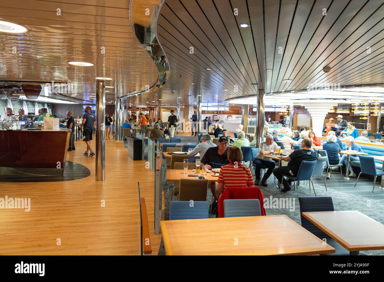 Passengers eating dinner in the restaurant on Stena Line Britannica ...