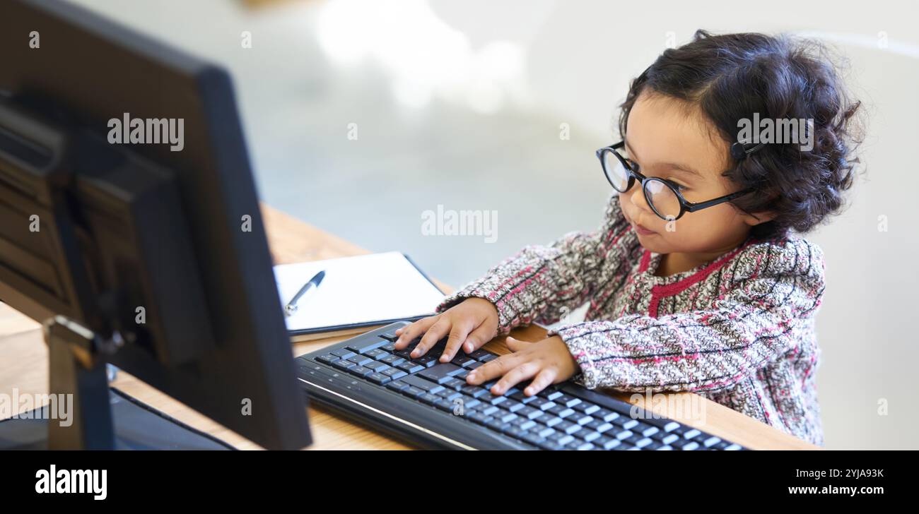 Baby girl typing on pc hi-res stock photography and images - Alamy