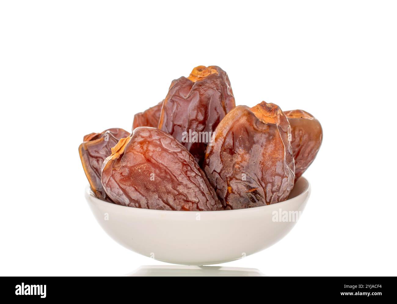 Dried sweet dates with homemade dishes isolated on white background ...
