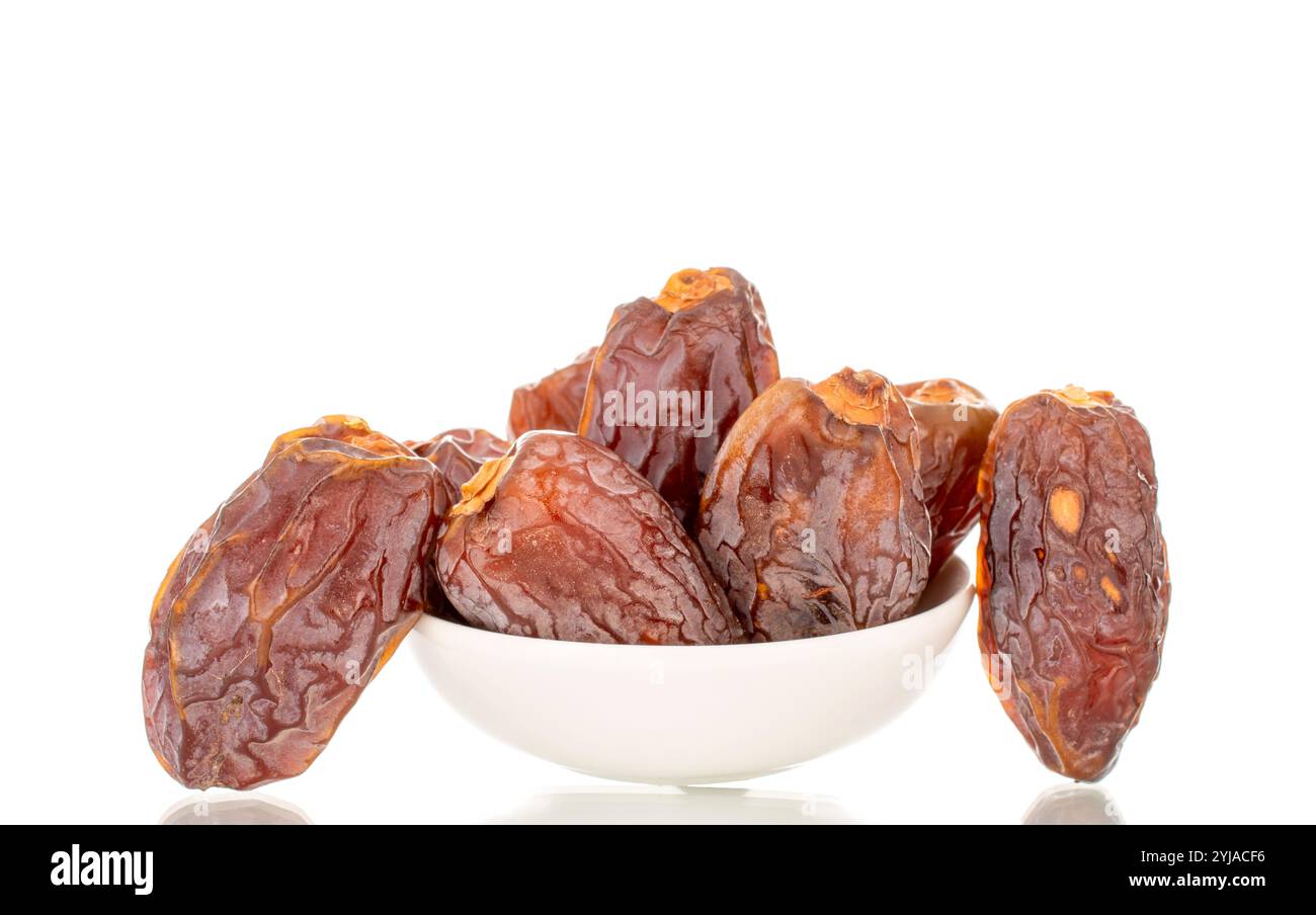 Dried sweet dates with homemade dishes isolated on white background ...