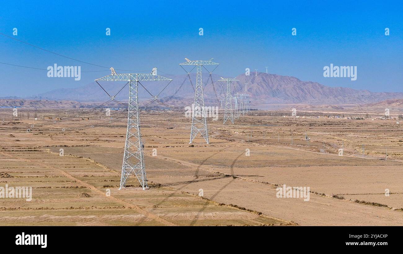 ZHANGYE, CHINA - NOVEMBER 14, 2024 - Construction workers set up a ...