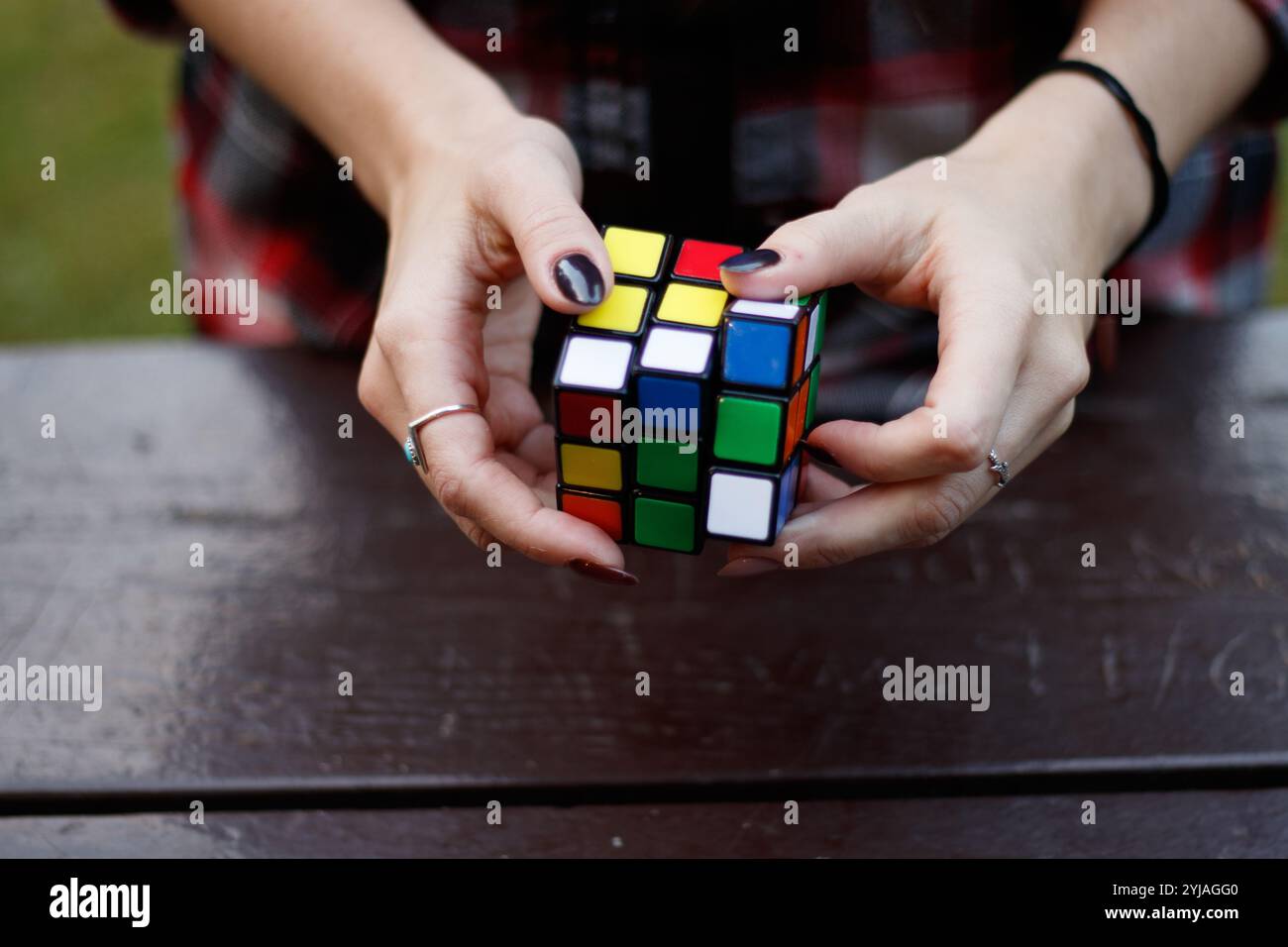 Vancouver, Canada - Oct1,2019: Hands manipulating a colorful Rubik's ...
