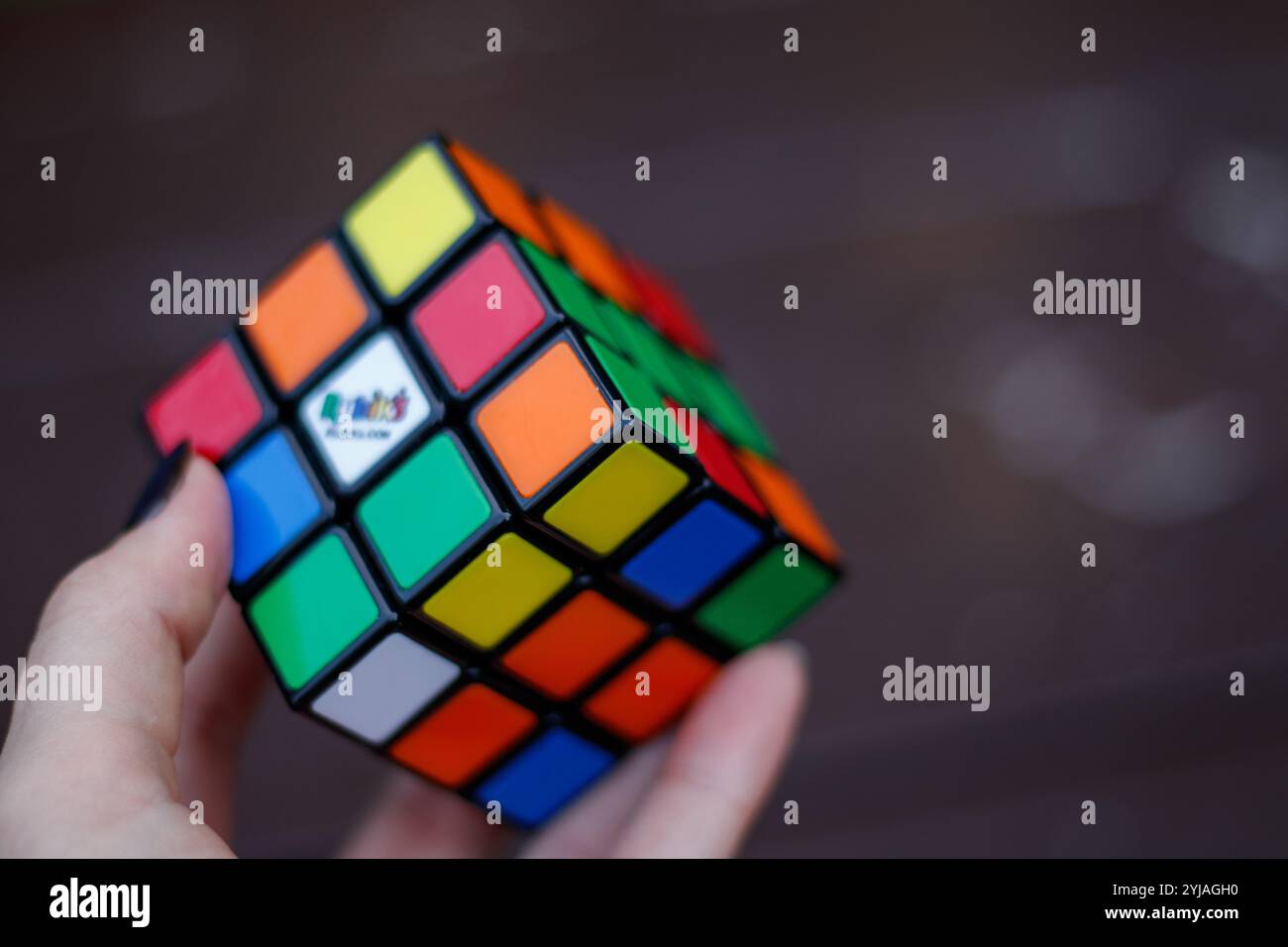 Vancouver, Canada - Oct1,2019: Hands manipulating a colorful Rubik's ...