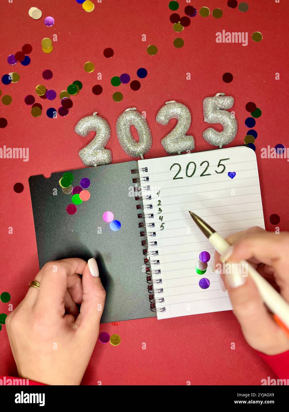 Back to life, goal list concept. Woman's hand writing in empty notebook ...