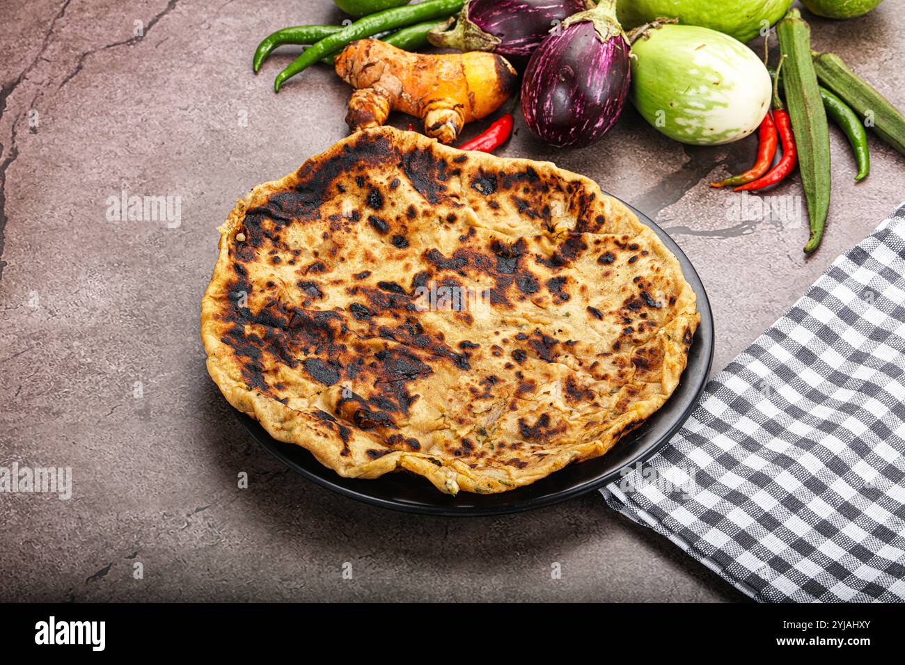 Indian cuisine stuffed Aloo paratha - bread with potato Stock Photo - Alamy