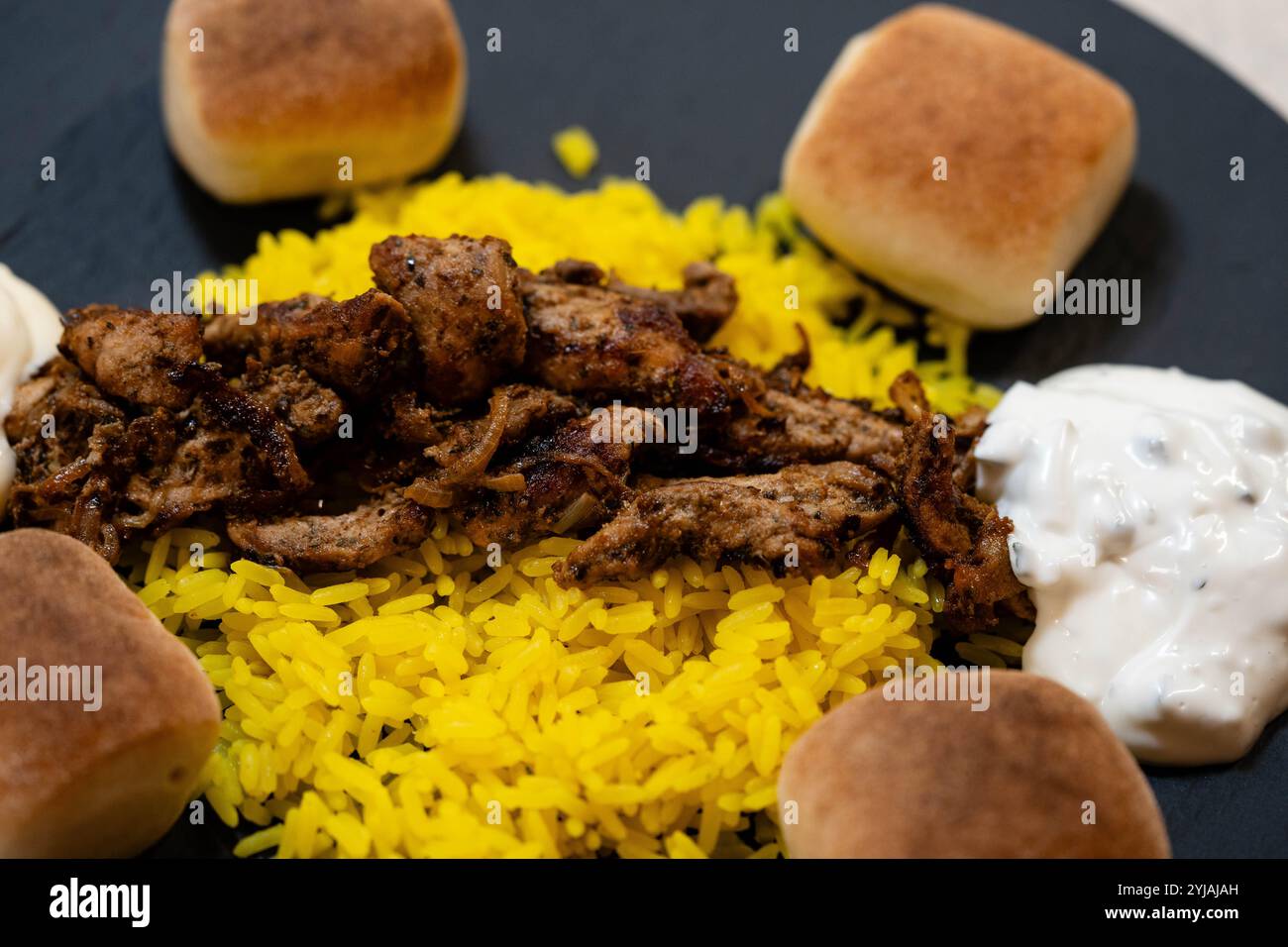 Pan-fried gyros with homemade tzatziki and Greek spices Stock Photo - Alamy