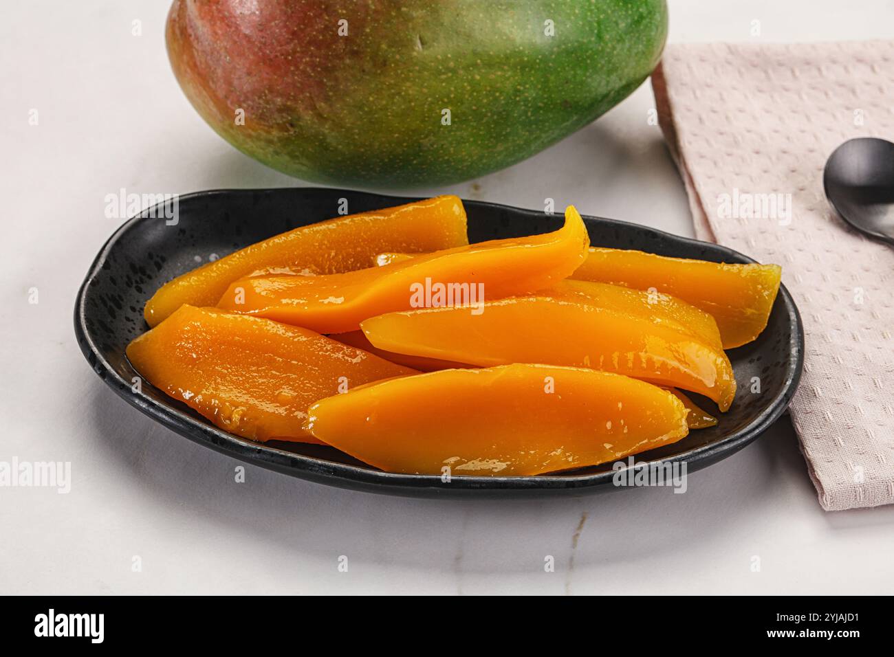 Canned mango slices with syrop in the bowl Stock Photo - Alamy
