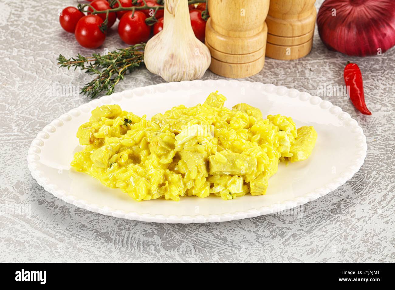 Italian cuisine - yellow risotto with chicken and soft cheese Stock ...