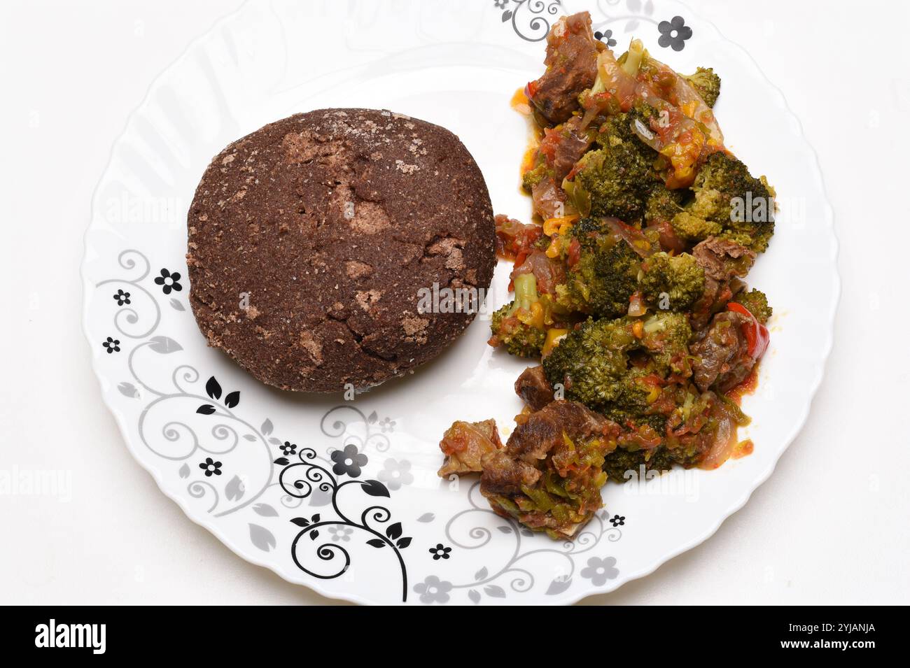 KENYAN BROWN UGALI SERVED WITH BROCCOLI AND BEEF STEW Stock Photo - Alamy