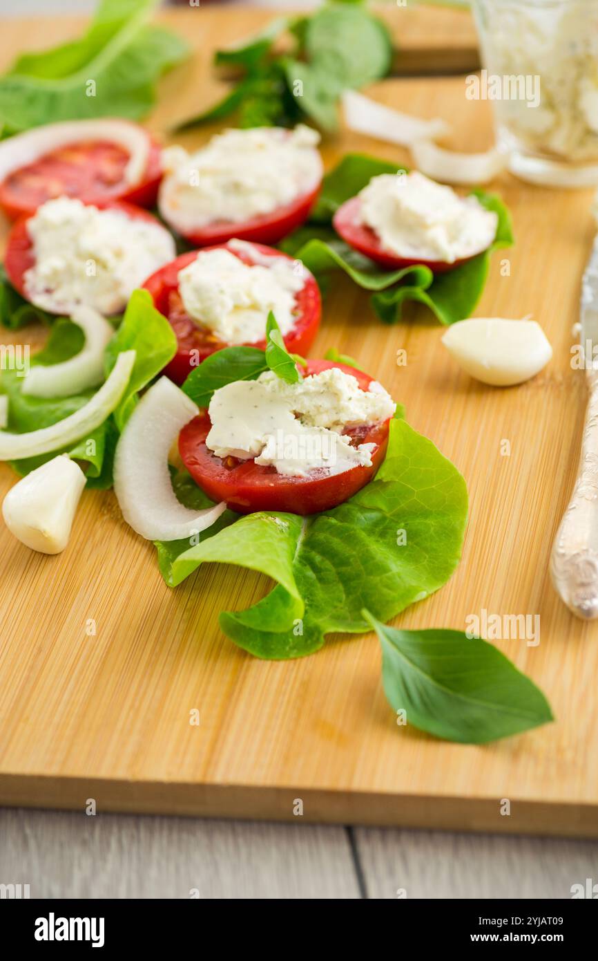 tomato wedges with cottage cheese filling and garlic, spicy appetizer ...