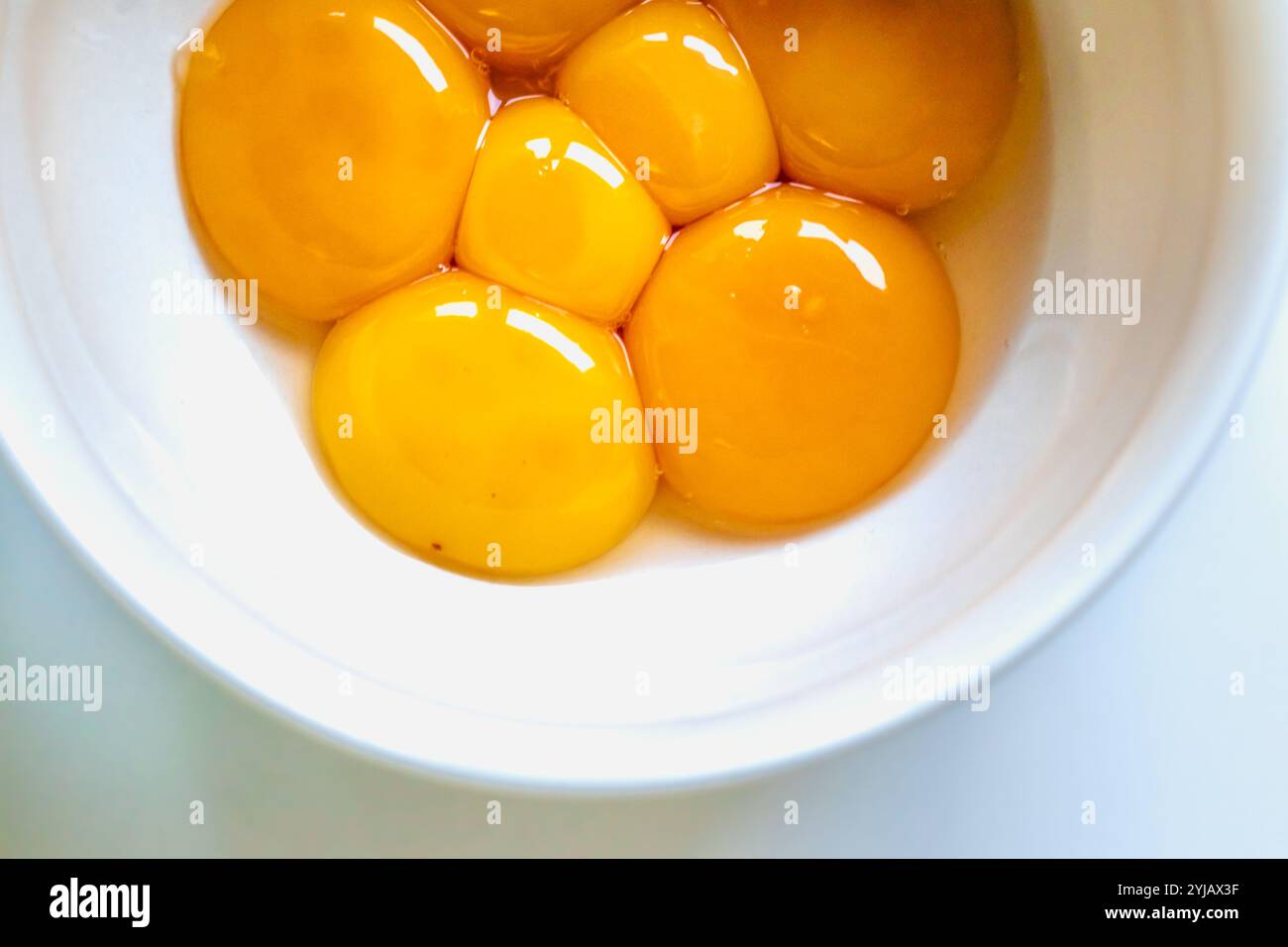 Double egg yolk in an egg Stock Photo - Alamy