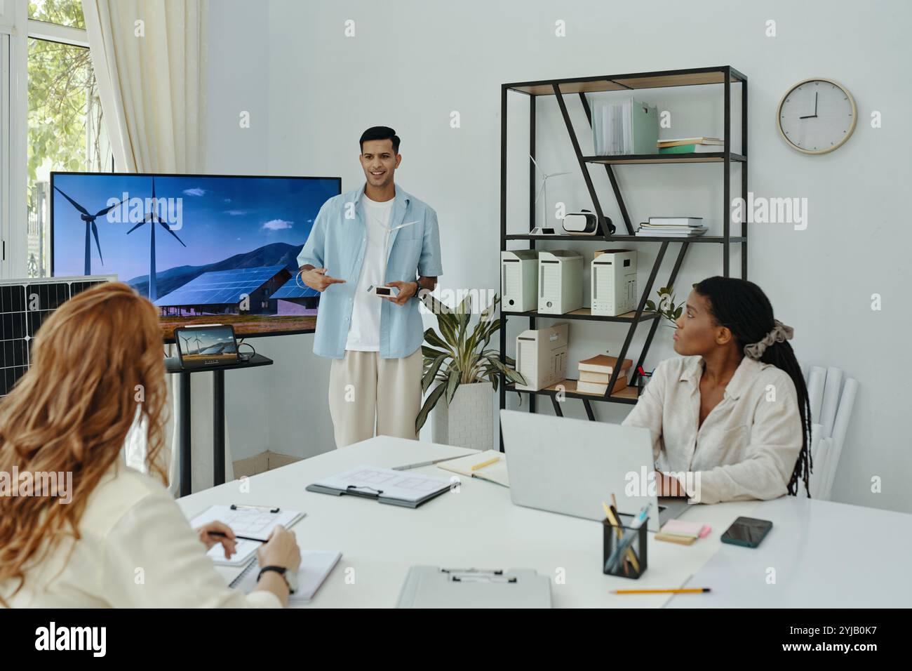 Man Presenting New Technology For Colleagues Stock Photo - Alamy