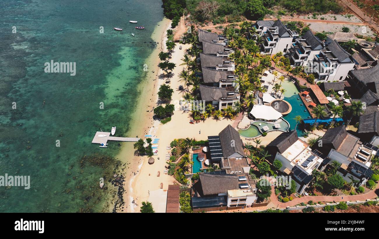 The photo showcases a panoramic view of a beachfront resort in ...