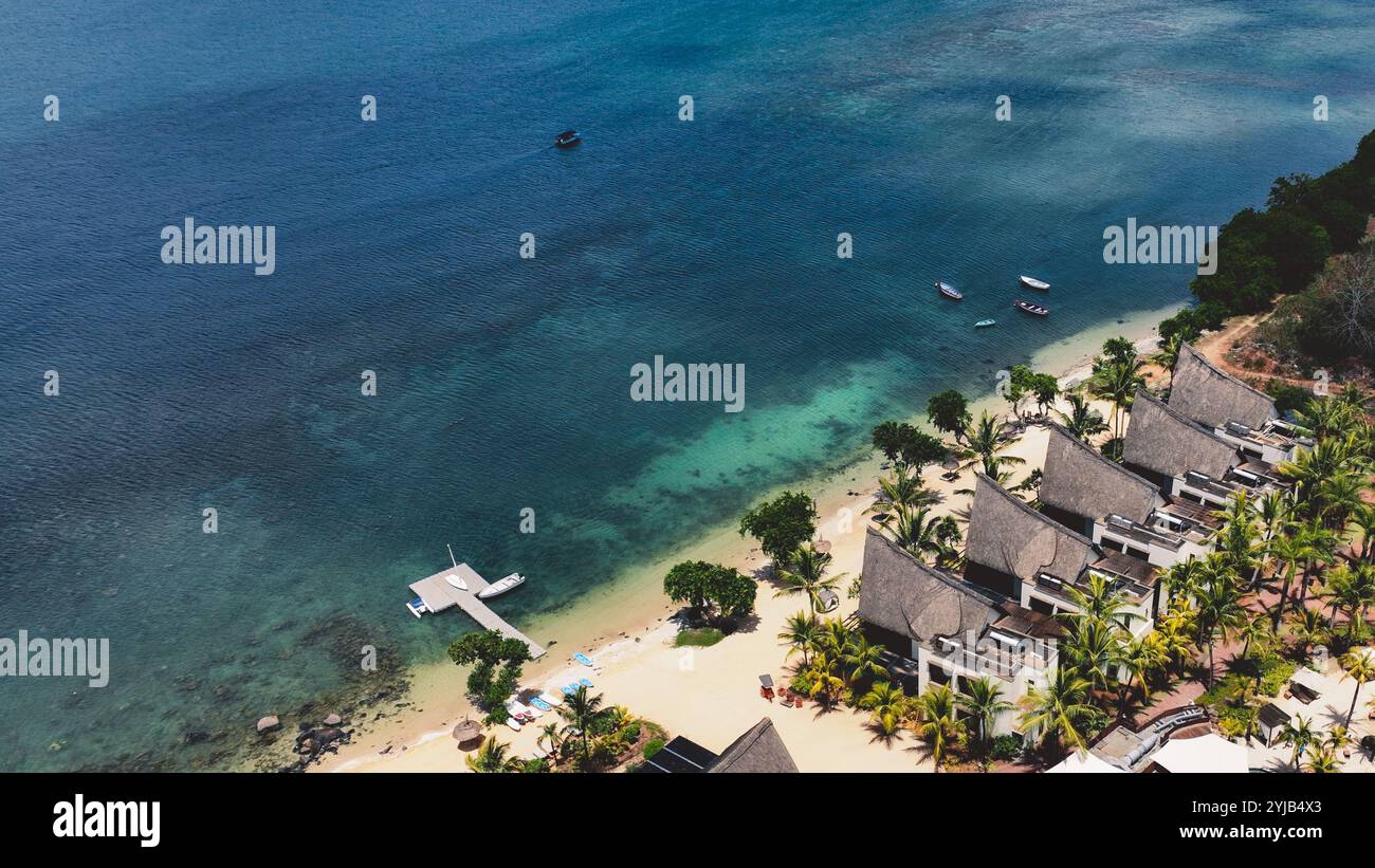 This aerial photograph captures a resort on a tropical island ...