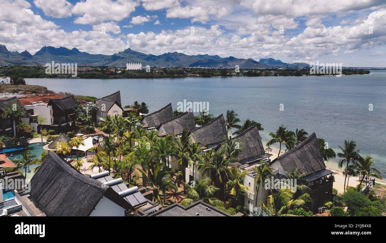 This aerial photograph showcases a tropical resort situated on the ...