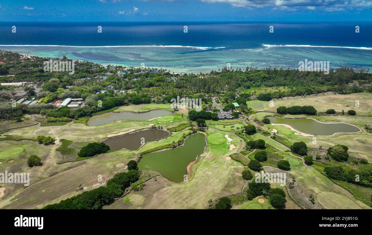 An aerial photograph showcasing a golf course situated near the ocean ...
