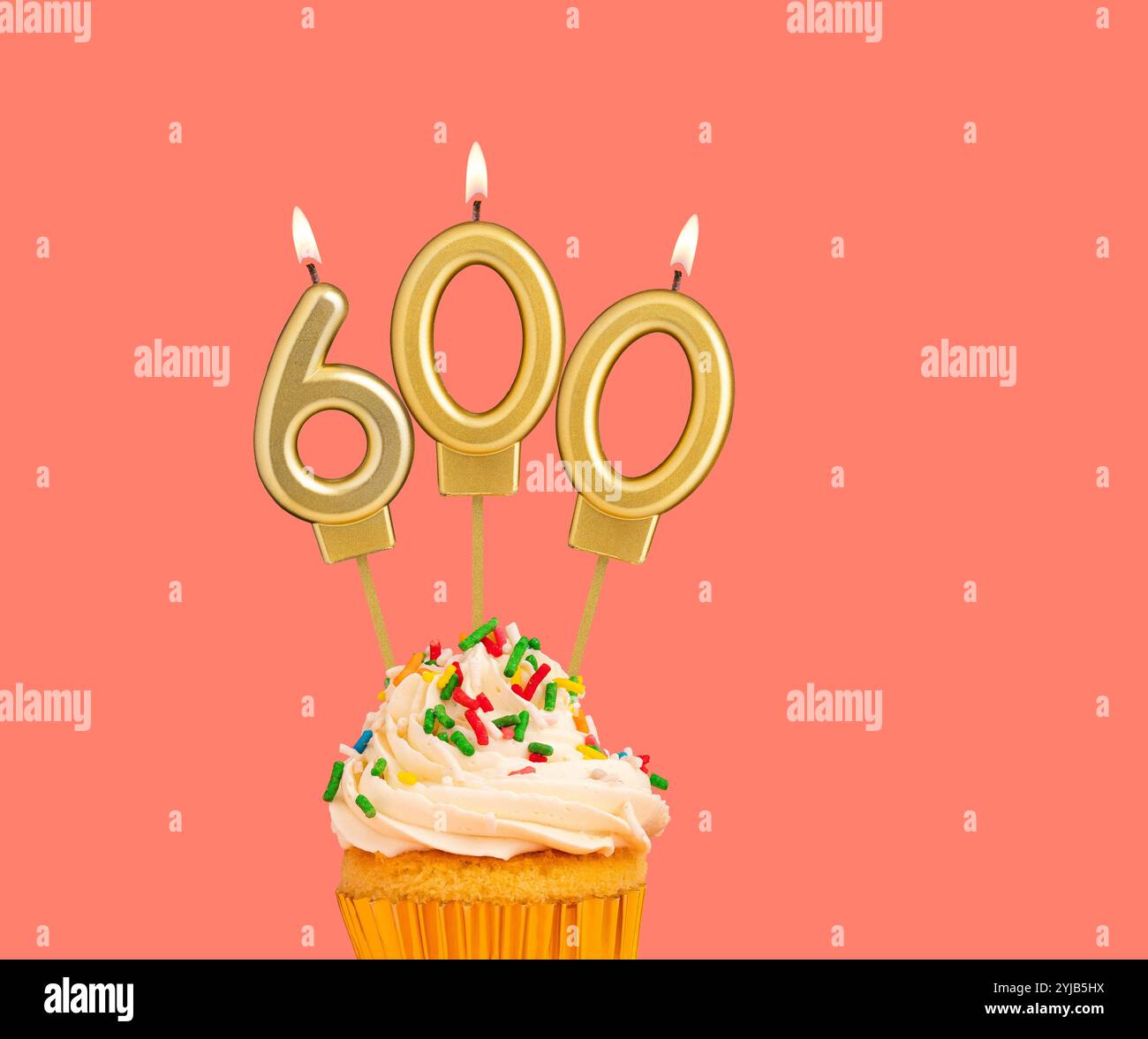 Birthday number 600 - Golden candle with cupcake Stock Photo - Alamy