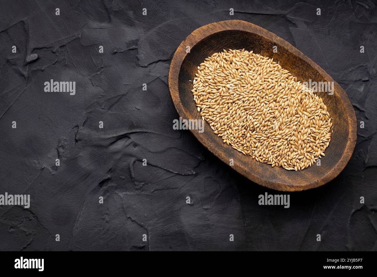 Bird seed food grain - Phalaris canariensis Stock Photo - Alamy
