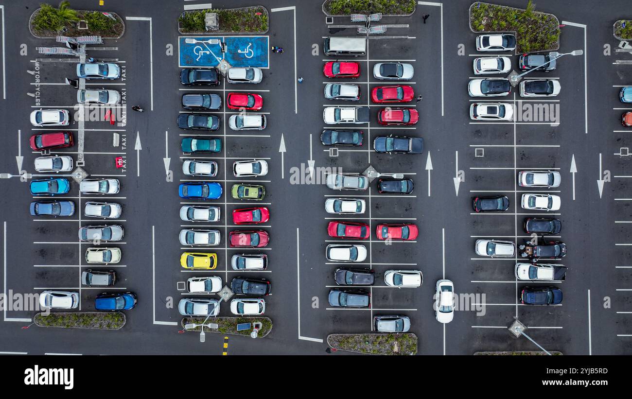 Aerial photograph showing a large parking lot filled with numerous ...