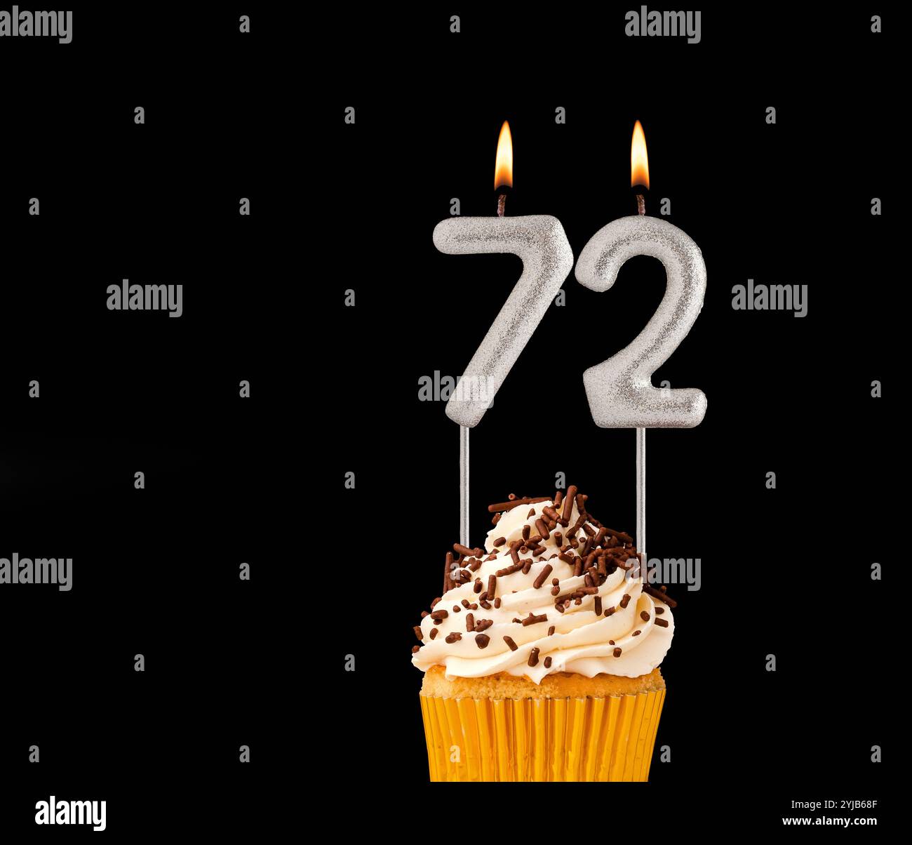 Number 72 shaped candles - Birthday cupcake on black background Stock ...
