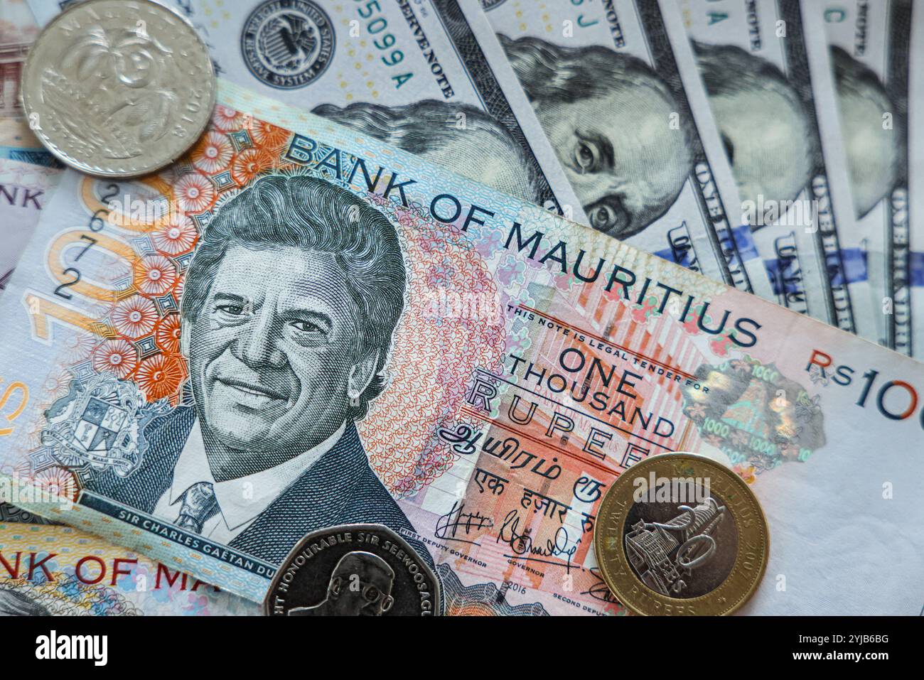 A pile of money featuring a prominent image of a man Stock Photo - Alamy