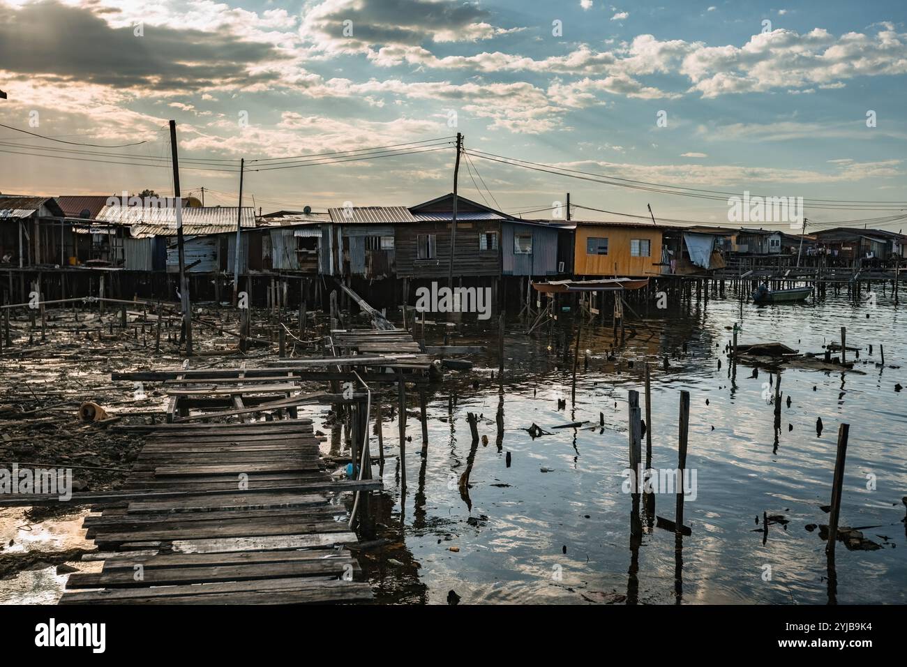 Fishing village houses over the water garbage poor areas in Sabah ...