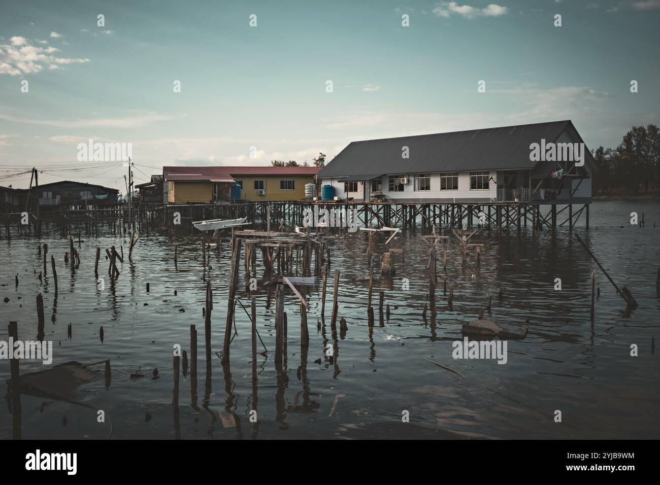 Fishing village houses over the water garbage poor areas in Sabah ...