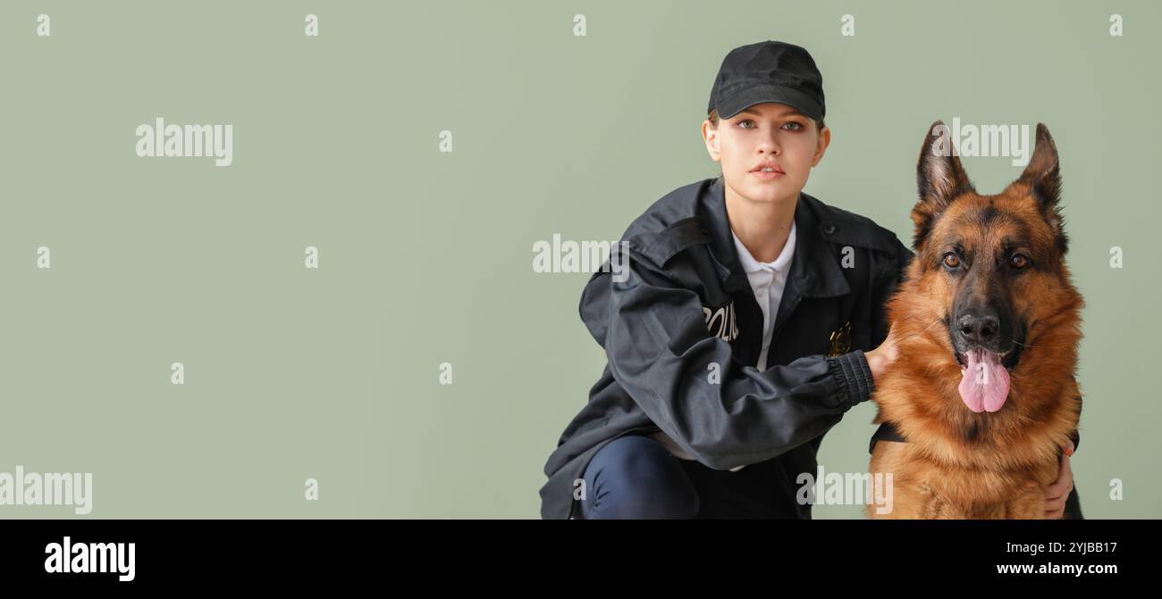 Female police officer with dog on green background with space for text ...