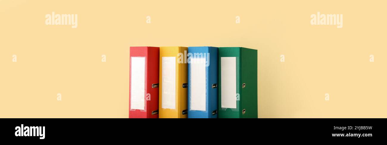 Office folders on beige background Stock Photo - Alamy