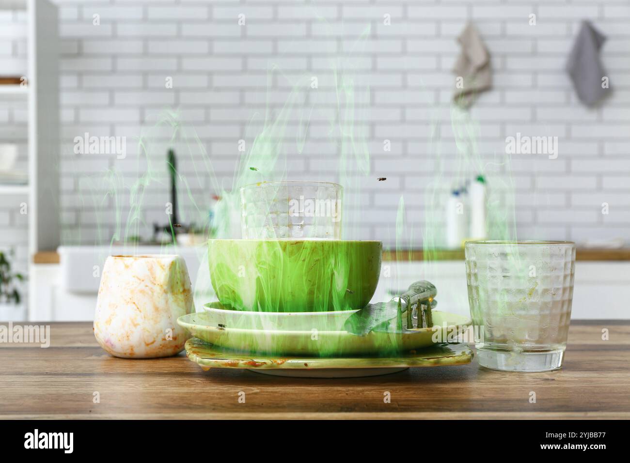 Table with dirty smelly dishes in kitchen Stock Photo - Alamy