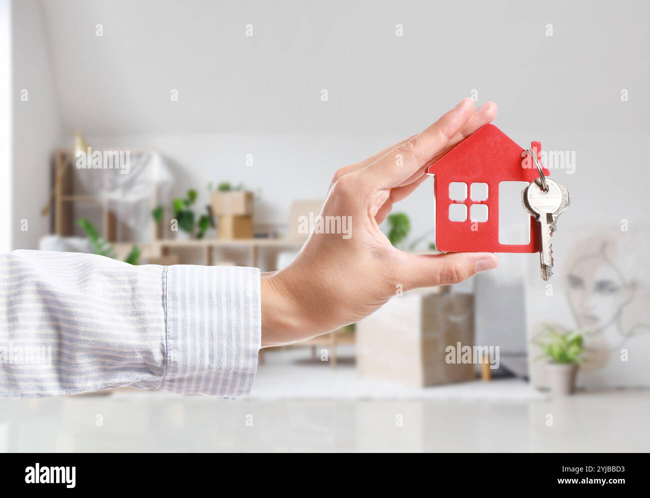 Female hand holding keys from new house in room on moving day Stock ...