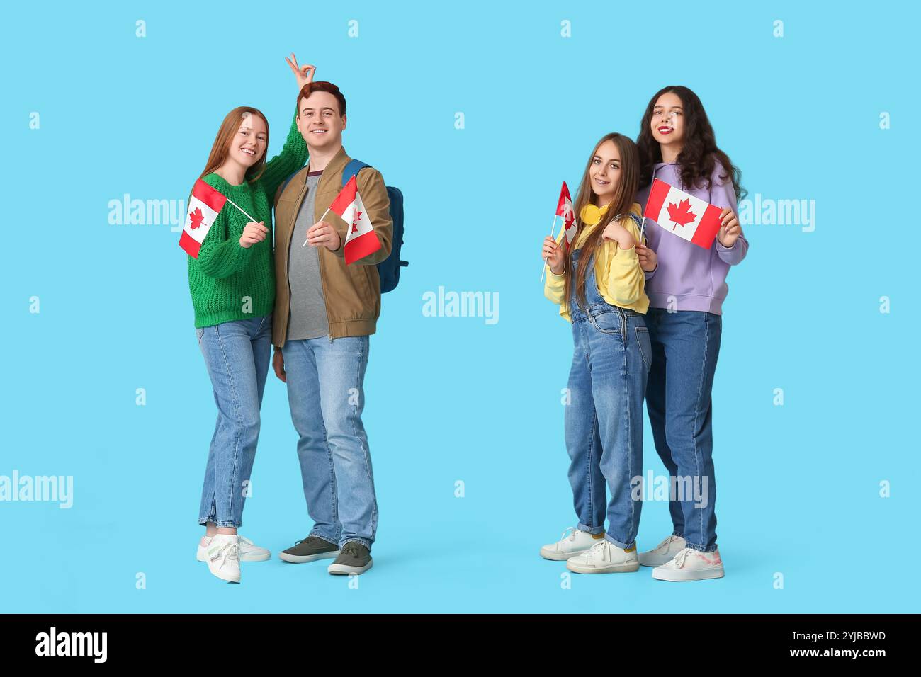 Group of students with flags of Canada on blue background Stock Photo ...