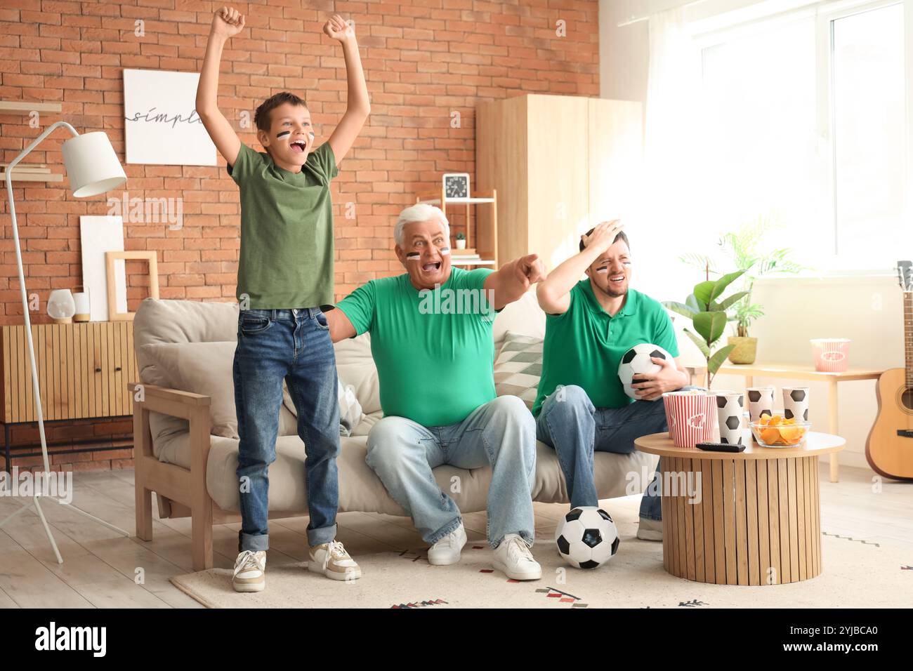 Father grandfather cheering boy hi-res stock photography and images - Alamy