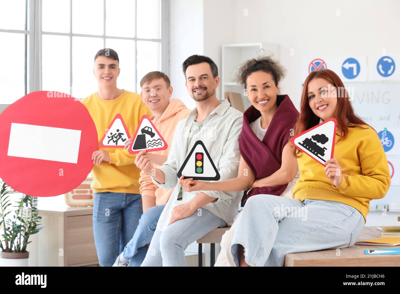 People with traffic signs at driving school Stock Photo - Alamy