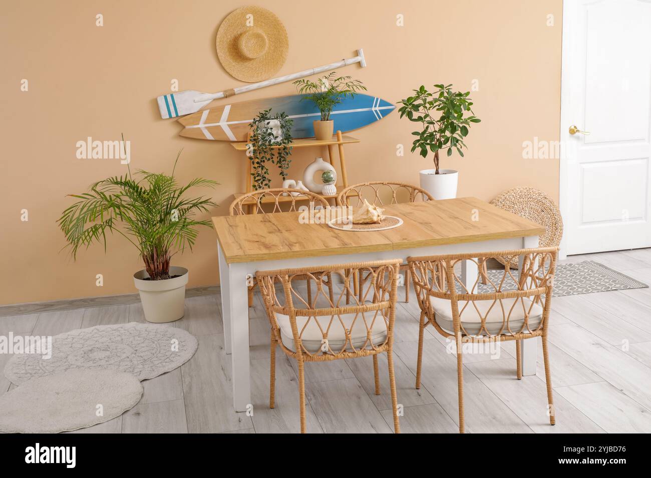 Dining table and surfboard with paddle Stock Photo - Alamy