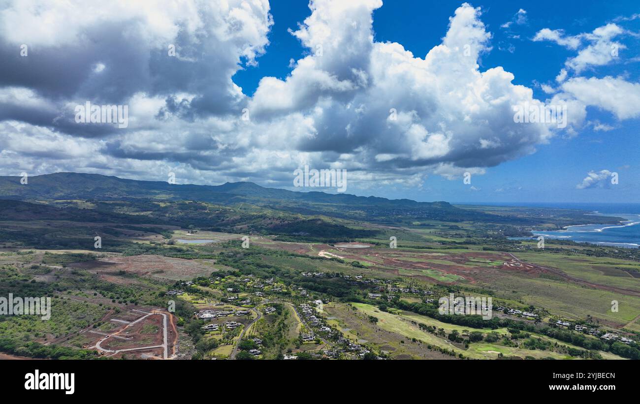 An aerial photograph capturing the expanse of a vibrant green valley in ...