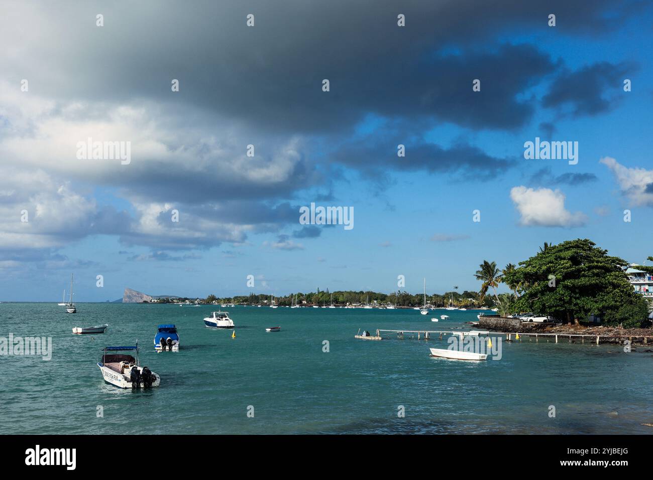 Aerial view of a group of boats floating on the water, creating a ...