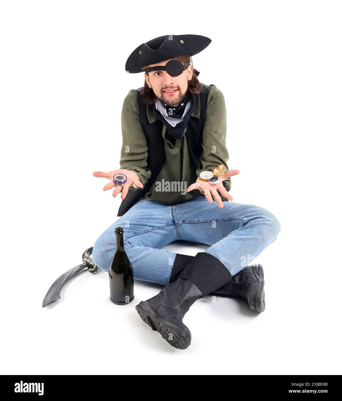 Confused young pirate with compasses on white background Stock Photo ...