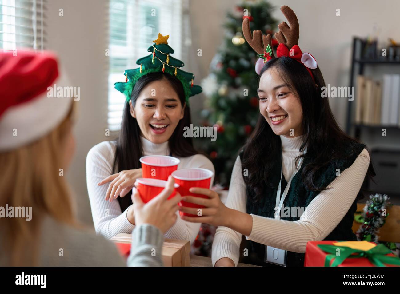 Festive Friends Celebrating Christmas with Joyful Toasts and Holiday ...